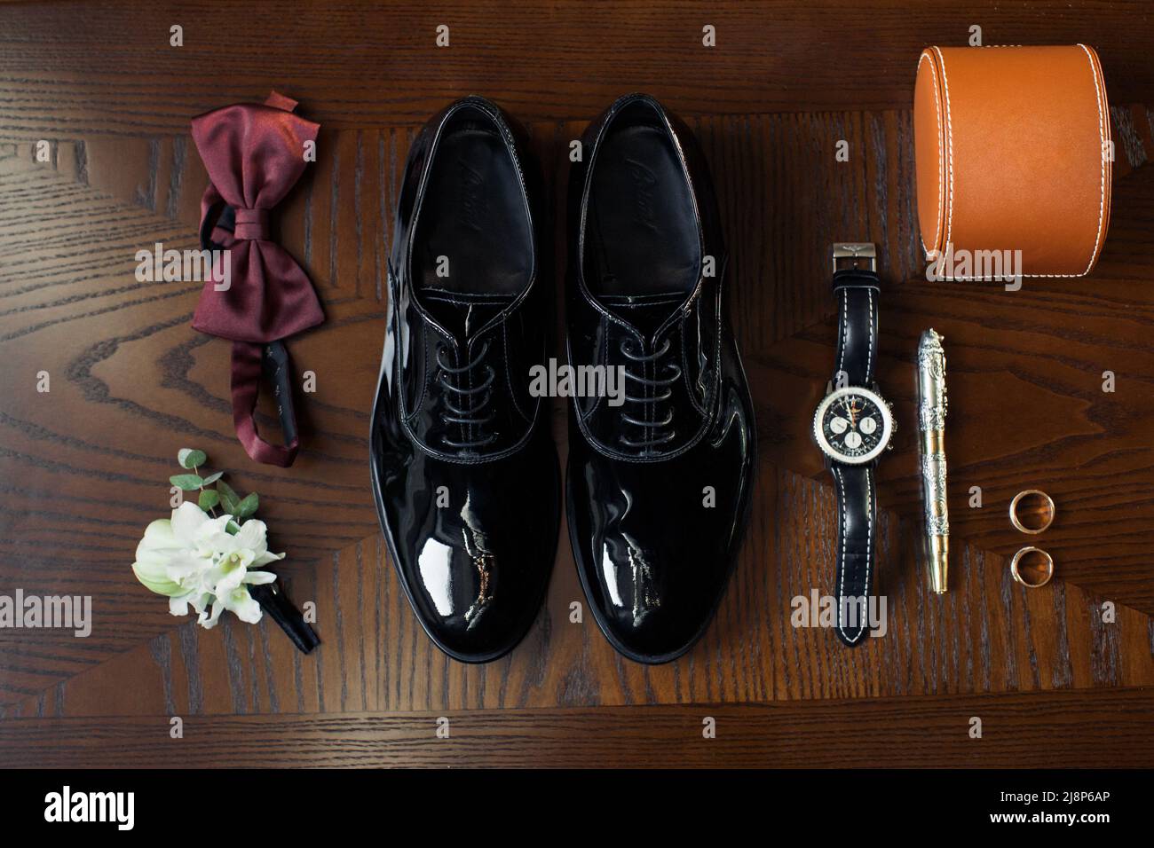 Wedding black shoes and accessories on the wooden table Stock Photo - Alamy