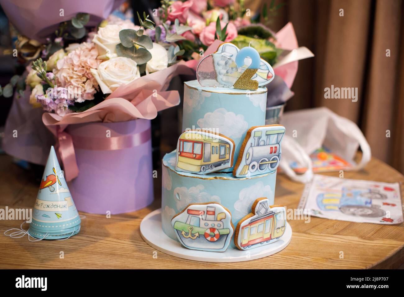 Multilevel birthday cake decorated with train and ship figurines Stock ...