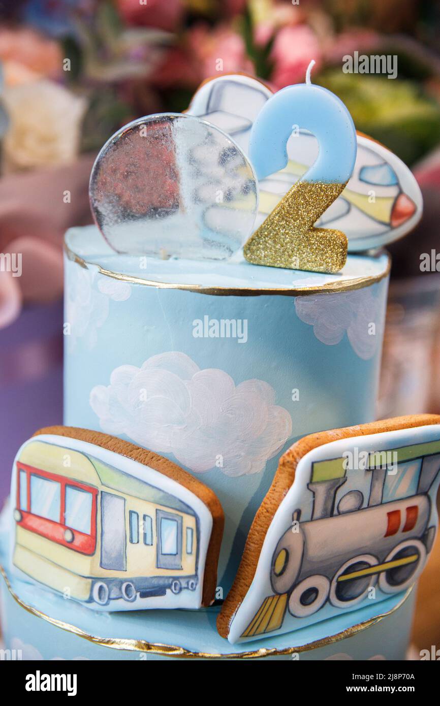 Multilevel birthday cake decorated with train and ship figurines Stock ...