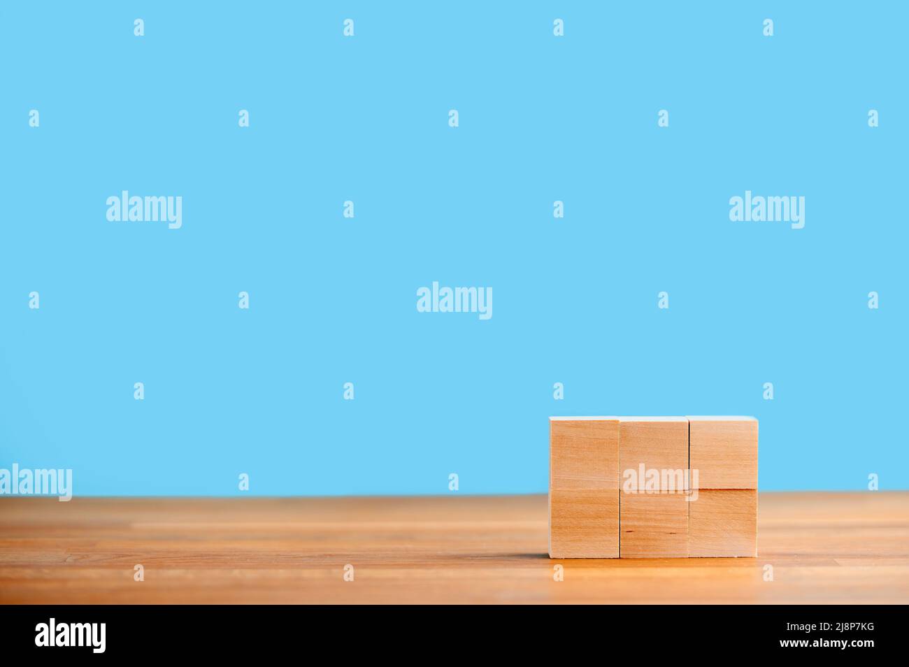 Blank wooden block cubes on a blue background for your text. free space ...