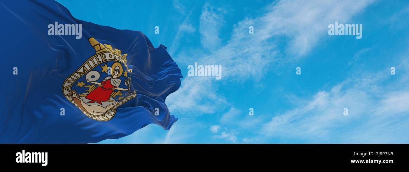 official flag of Oslo 1924 , Norway at cloudy sky background on sunset ...