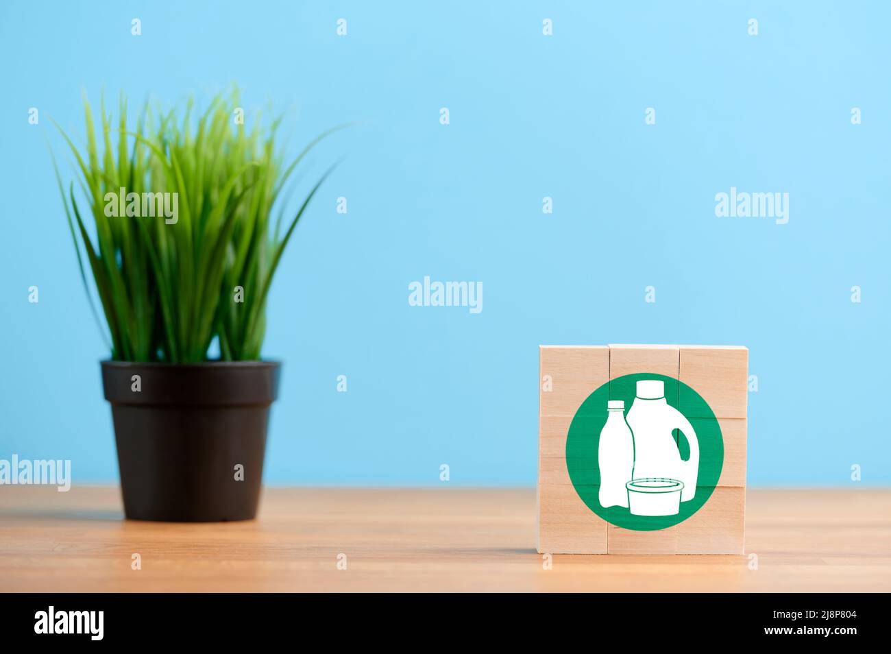 Ecology concept, wooden blocks with icon of plastics, plastic recycling ...