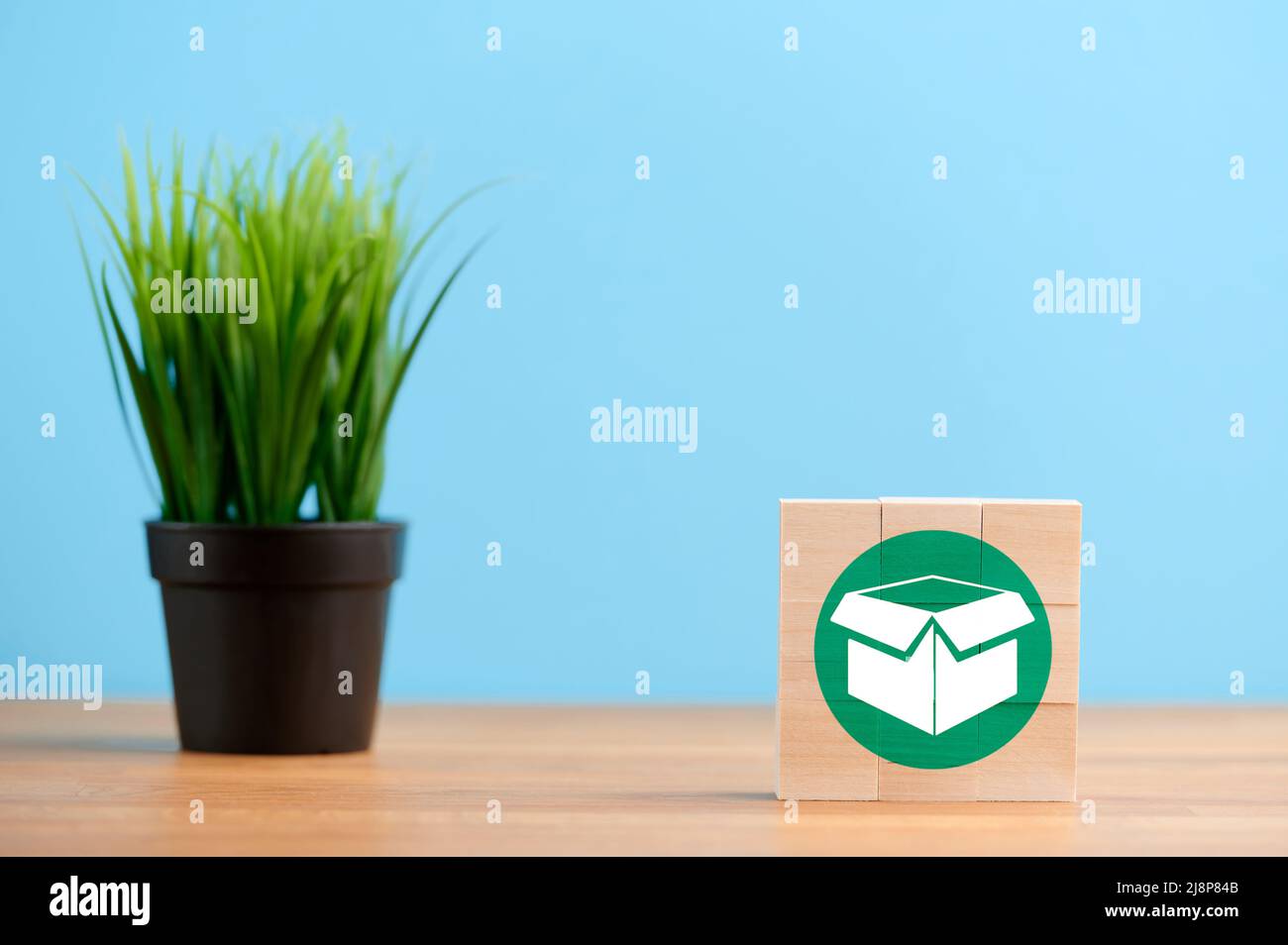 Wooden blocks on blue background with environmental symbols of ...