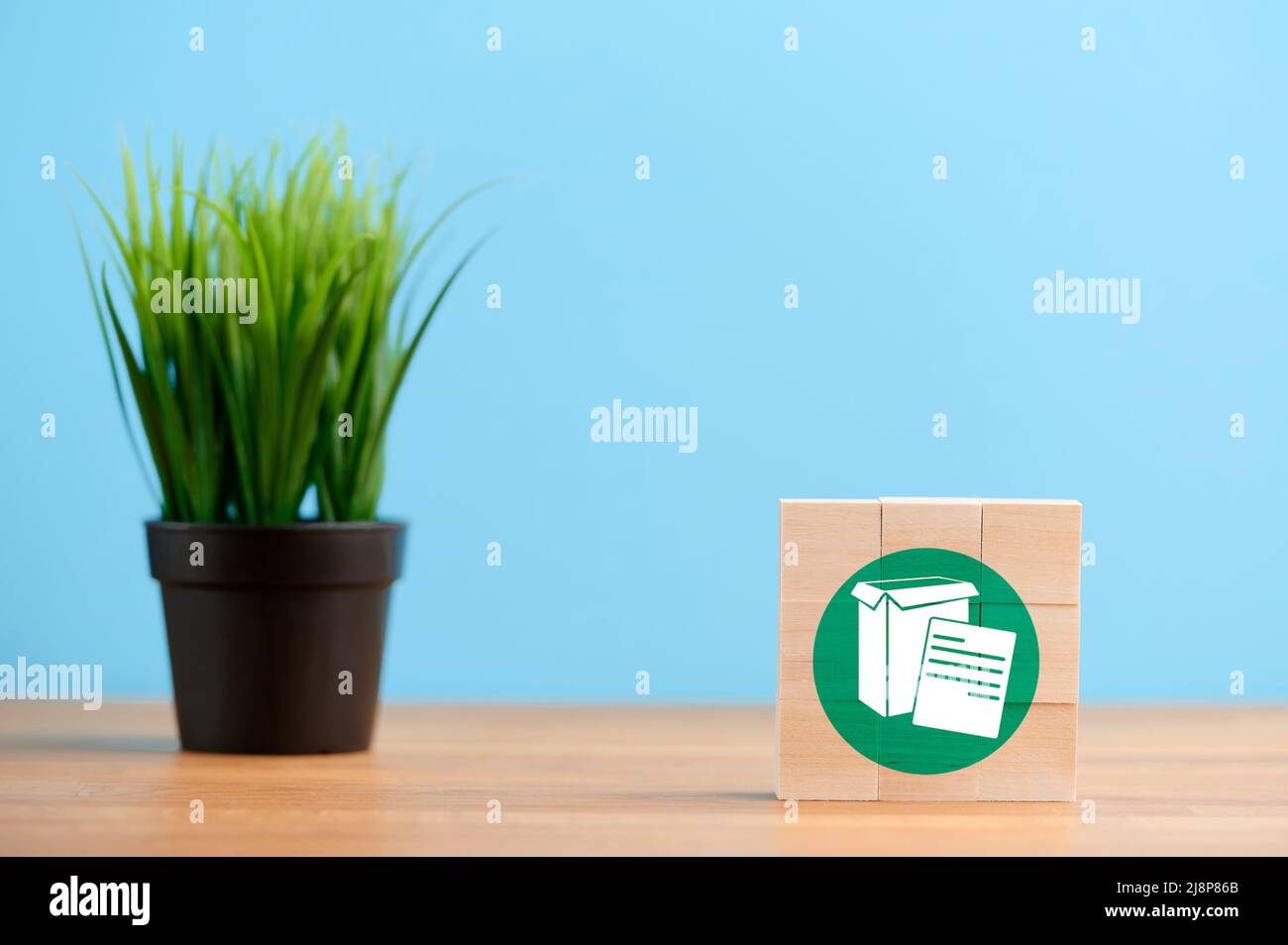 Wooden blocks on blue background with environmental symbol of mixed ...