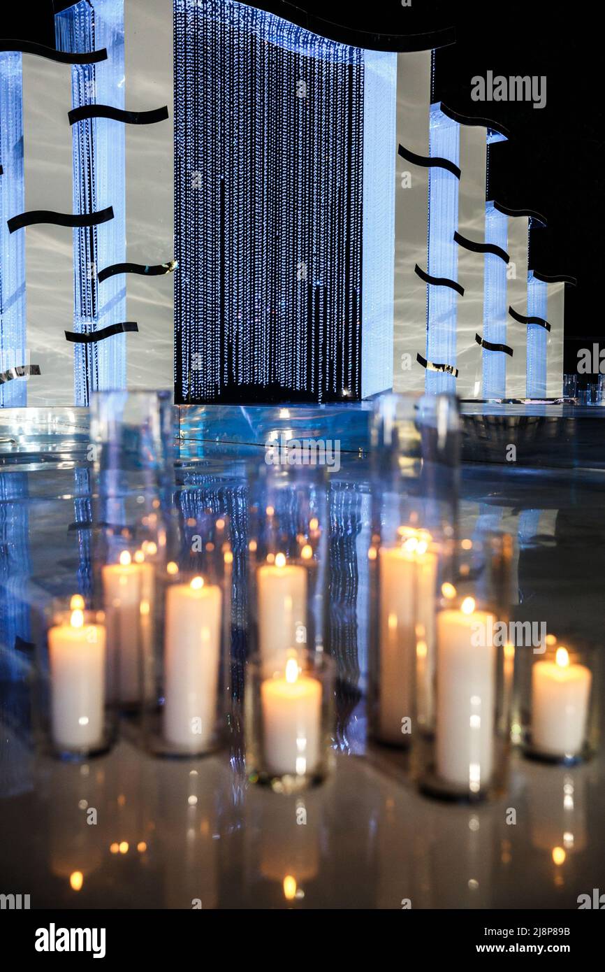 The arch for the wedding ceremony glows at night Stock Photo - Alamy