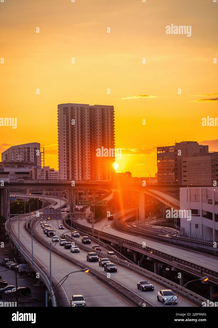 sunset traffic sun in miami usa florida Stock Photo - Alamy