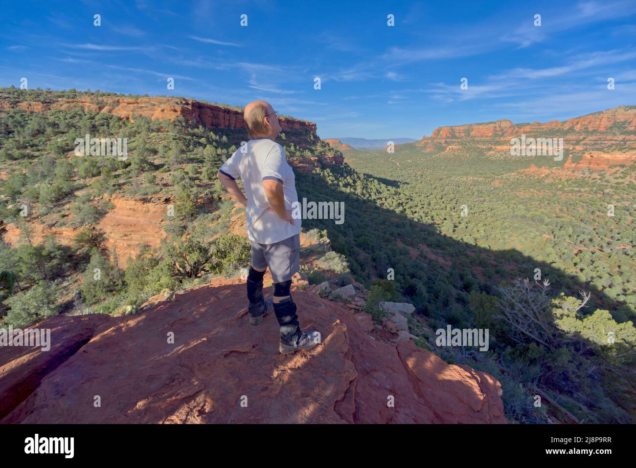 Man standing on rocks in desert landscape hi-res stock photography and ...