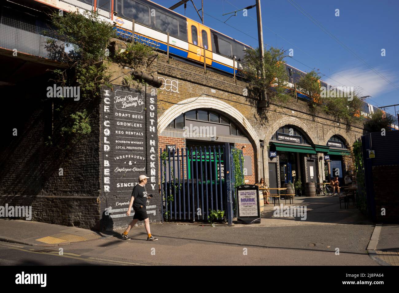 Small business redeveloped under railway arches by train and overground ...