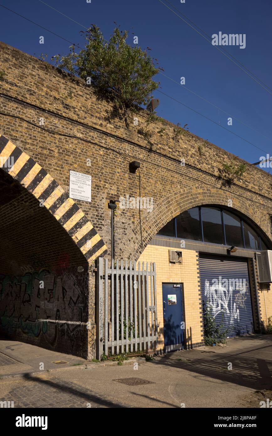 Small business redeveloped under railway arches by train and overground ...