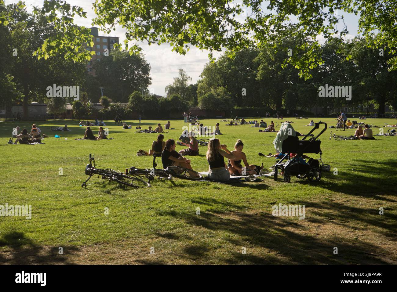 People enjoying spring sunshine in London Fields park in Hackney,London ...