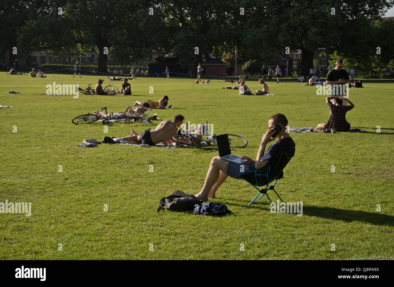 People enjoying spring sunshine in London Fields park in Hackney,London ...
