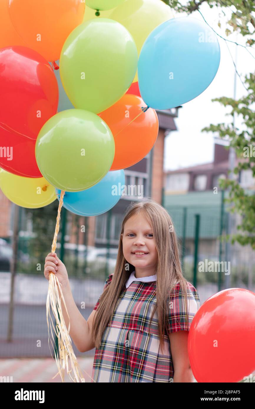 Teenage girl with colorful helium air balloons having fun outdoors ...