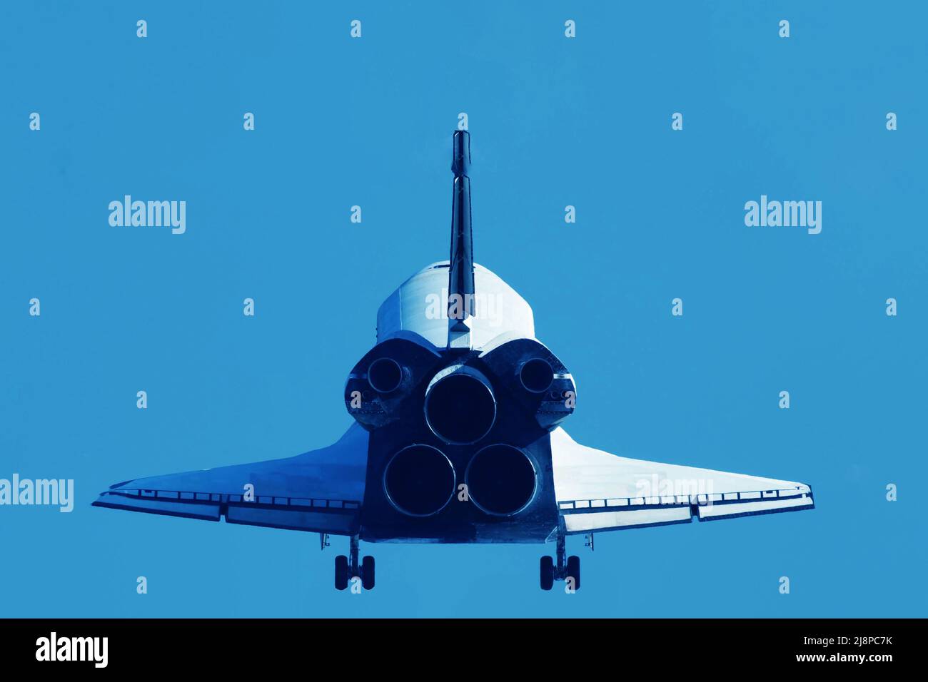 Space shuttle from behind, taking off. Elements of this image furnished ...