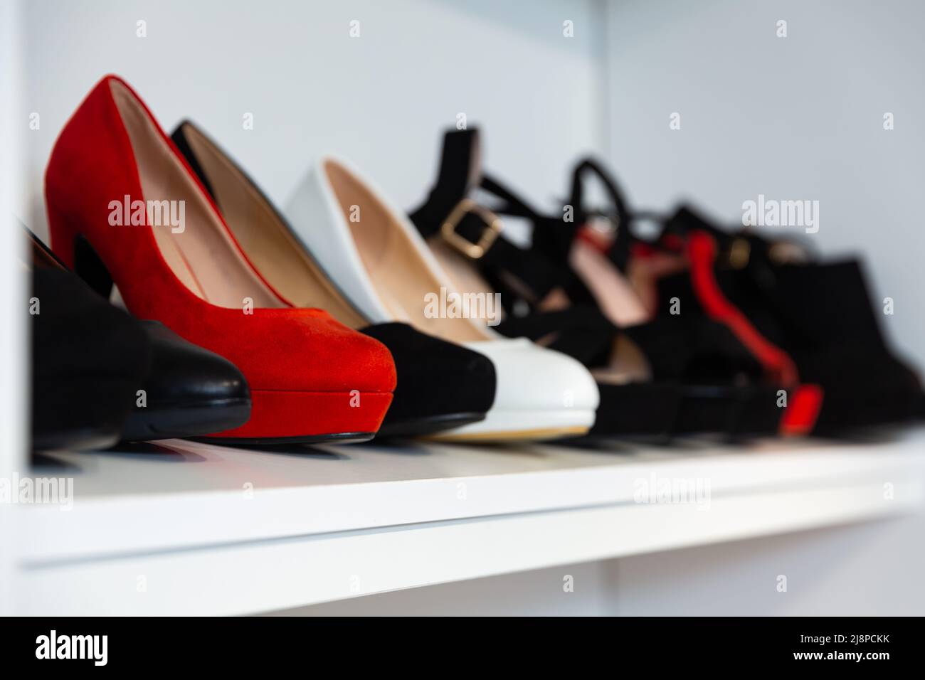 Counter with stylish high heeled shoes Stock Photo - Alamy