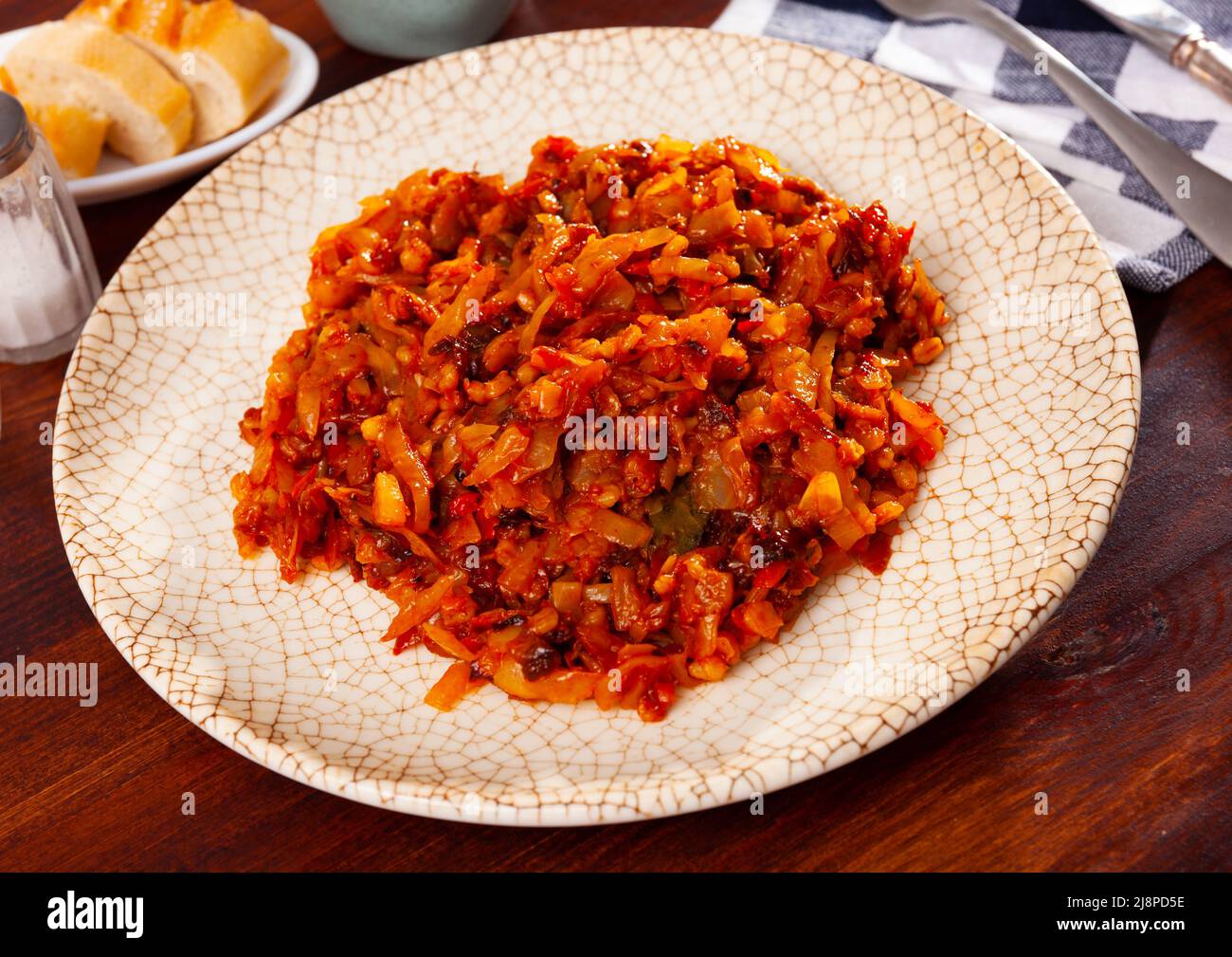 Braised white cabbage with pearl barley, carrot and onion Stock Photo ...