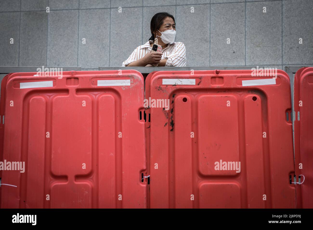 GUANGZHOU, CHINA - MAY 17, 2022 - A citizen in a gated community in ...