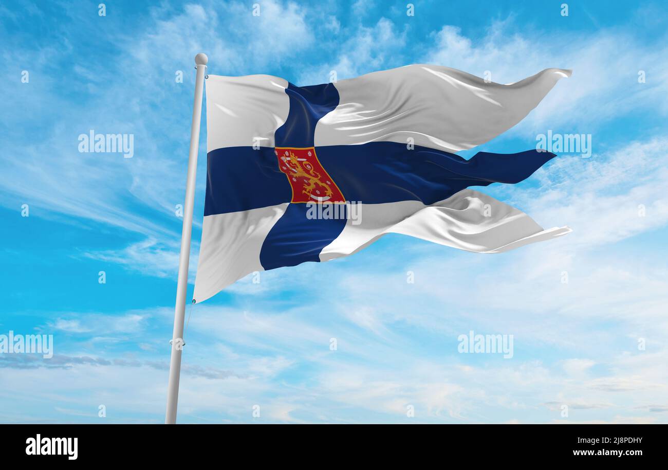 official flag of Military , Finland at cloudy sky background on sunset ...
