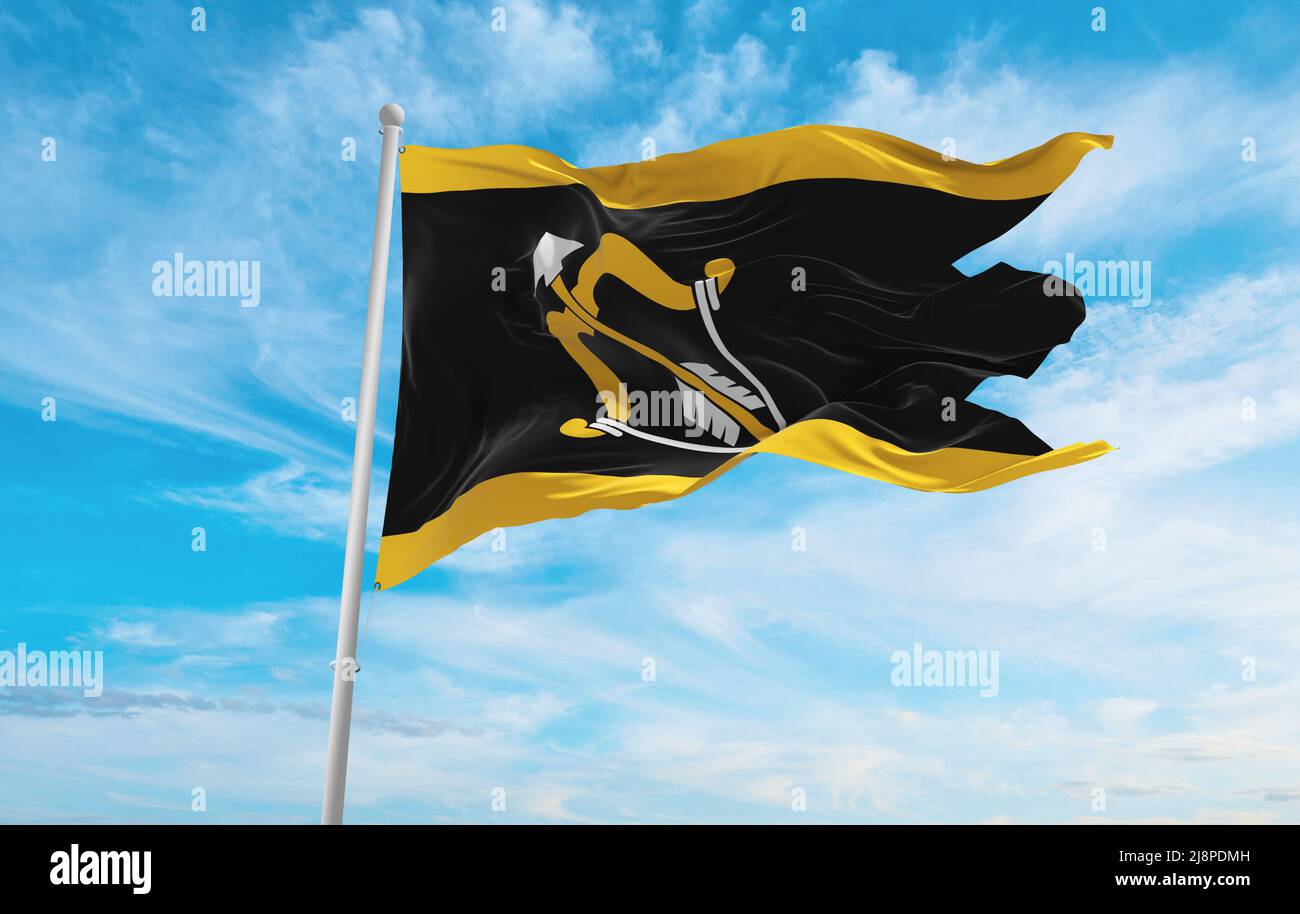 official flag of Northern Savonia , Finland at cloudy sky background on ...