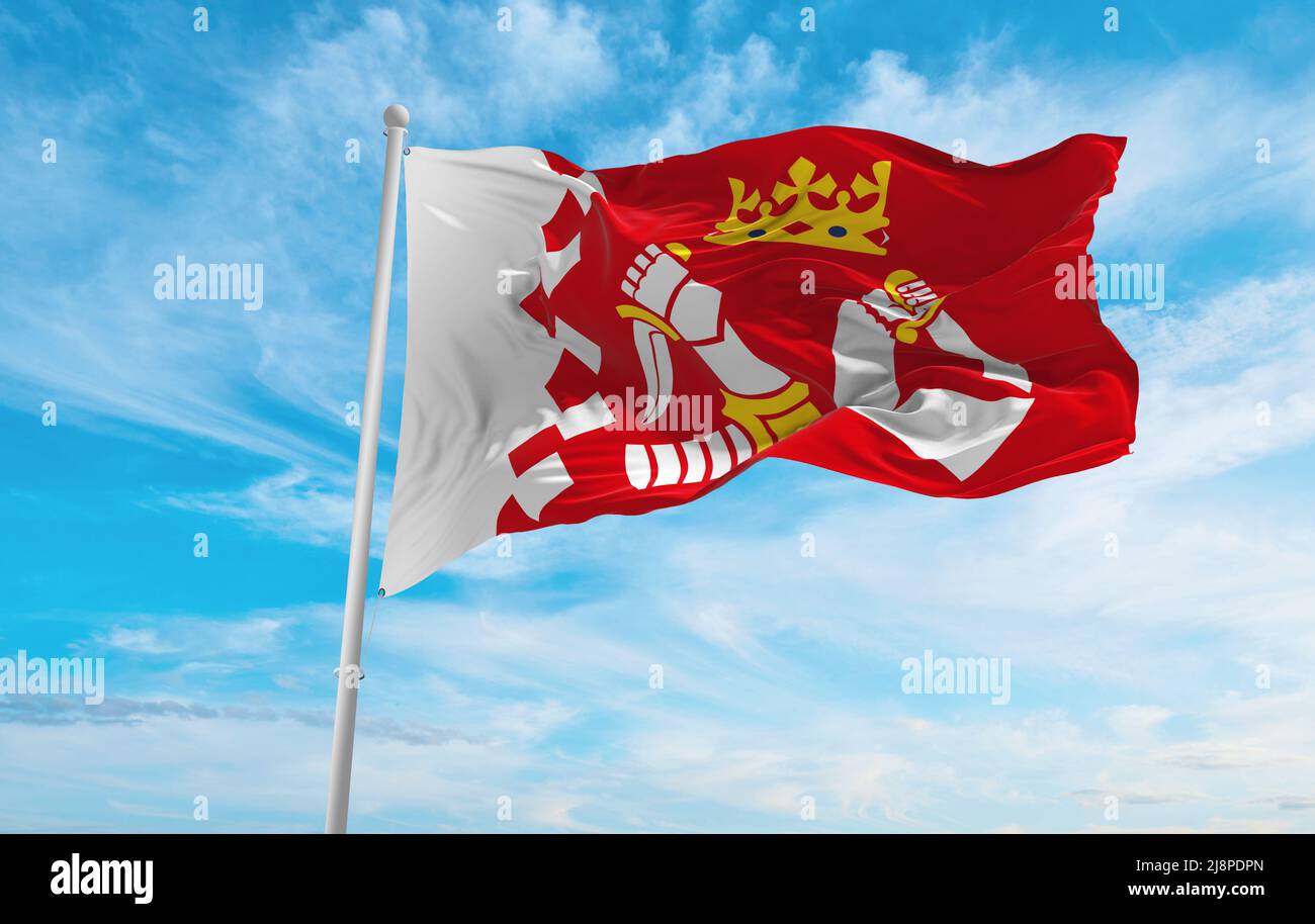 official flag of North karelia , Finland at cloudy sky background on ...