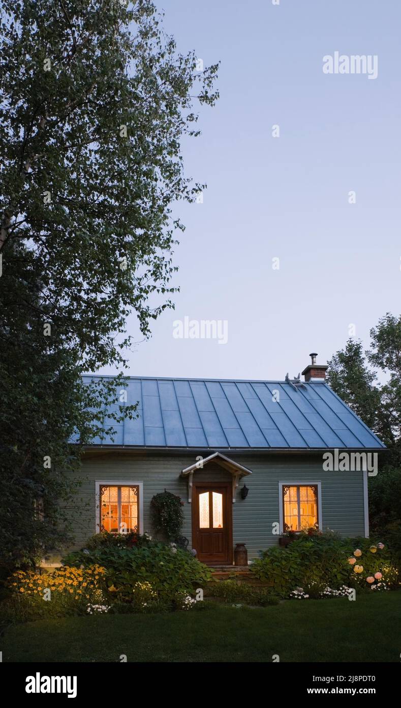 Old circa 1900 Canadiana cottage style home with olive green wood plank ...