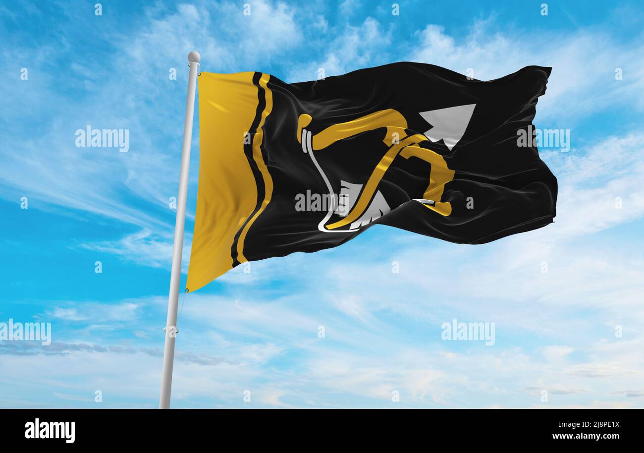 official flag of South Savonia , Finland at cloudy sky background on ...