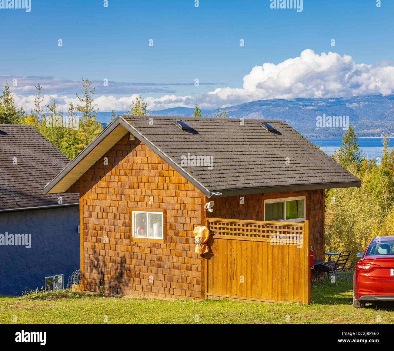 Log Cabin Camping. Cozy wooden cabin on shore of Lake. Travel photo ...