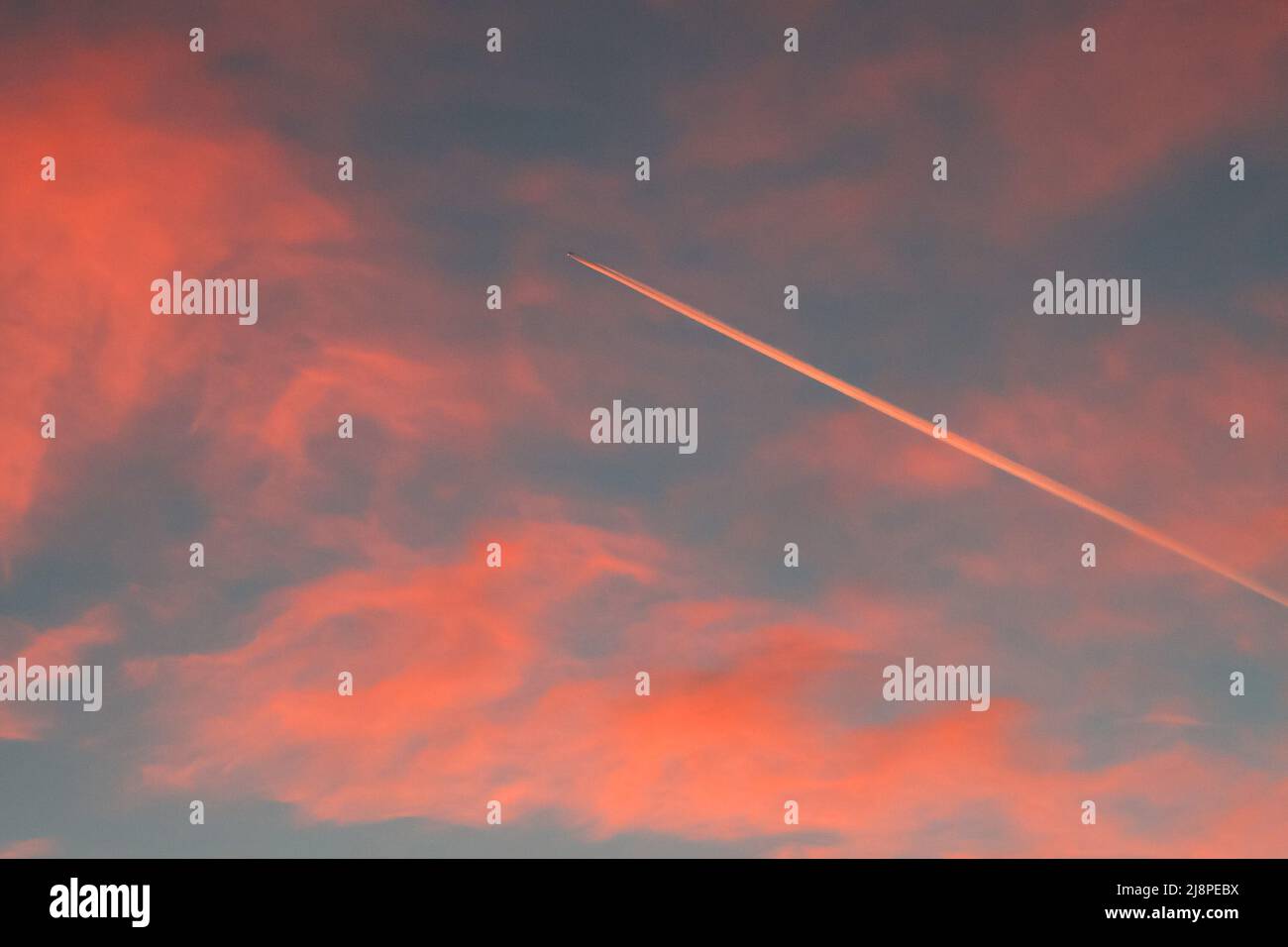 Jet travelling across red sky hi-res stock photography and images - Alamy