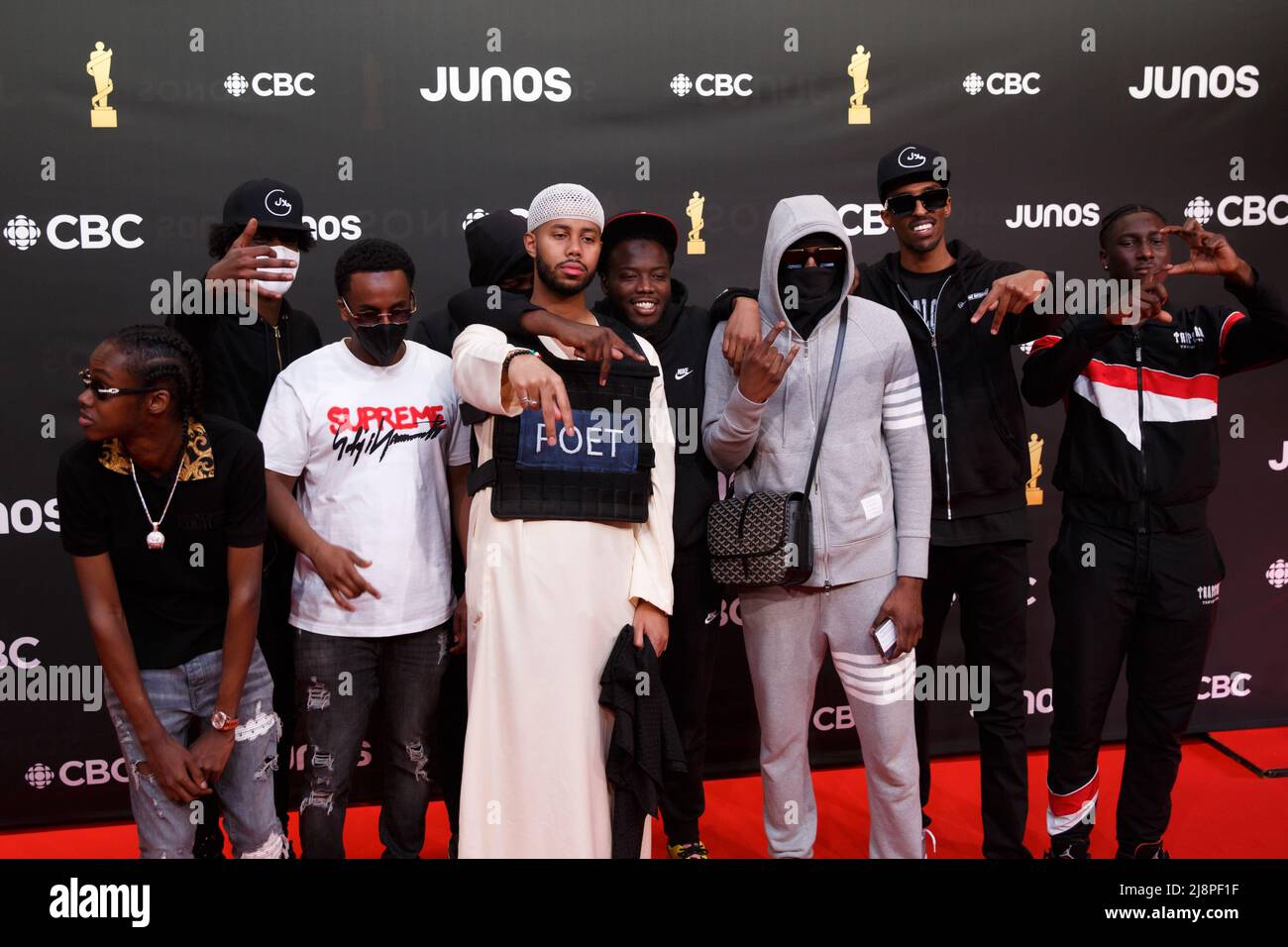 Mustafa The Poet (centre) wears a mock bomb vest on the Red Carpet at ...