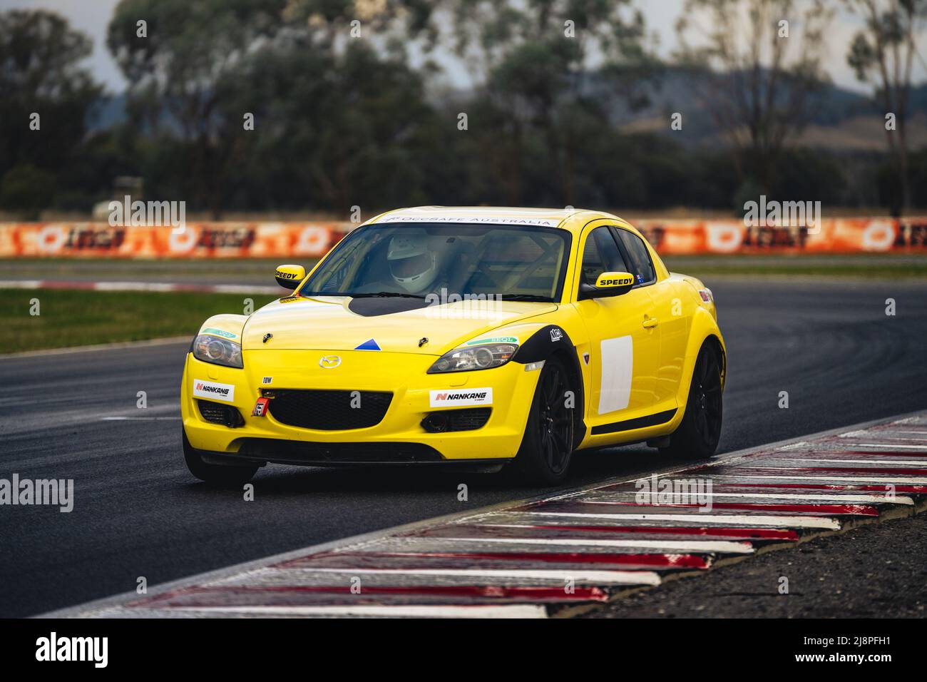 A yellow Mazda RX-8 doing laps of Winton Motor Raceway during a private ...