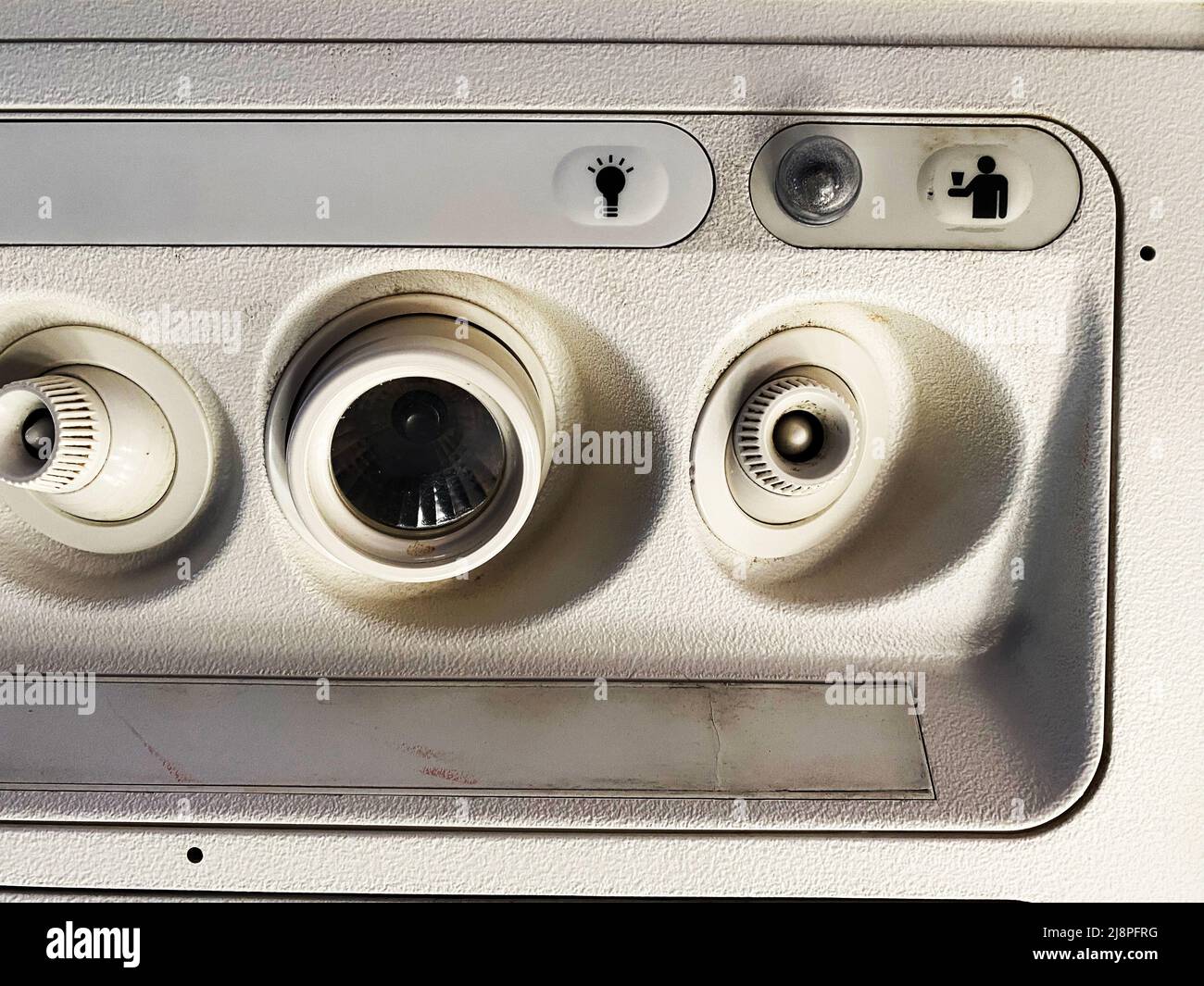 A flight attendant call button on an airplane Stock Photo - Alamy
