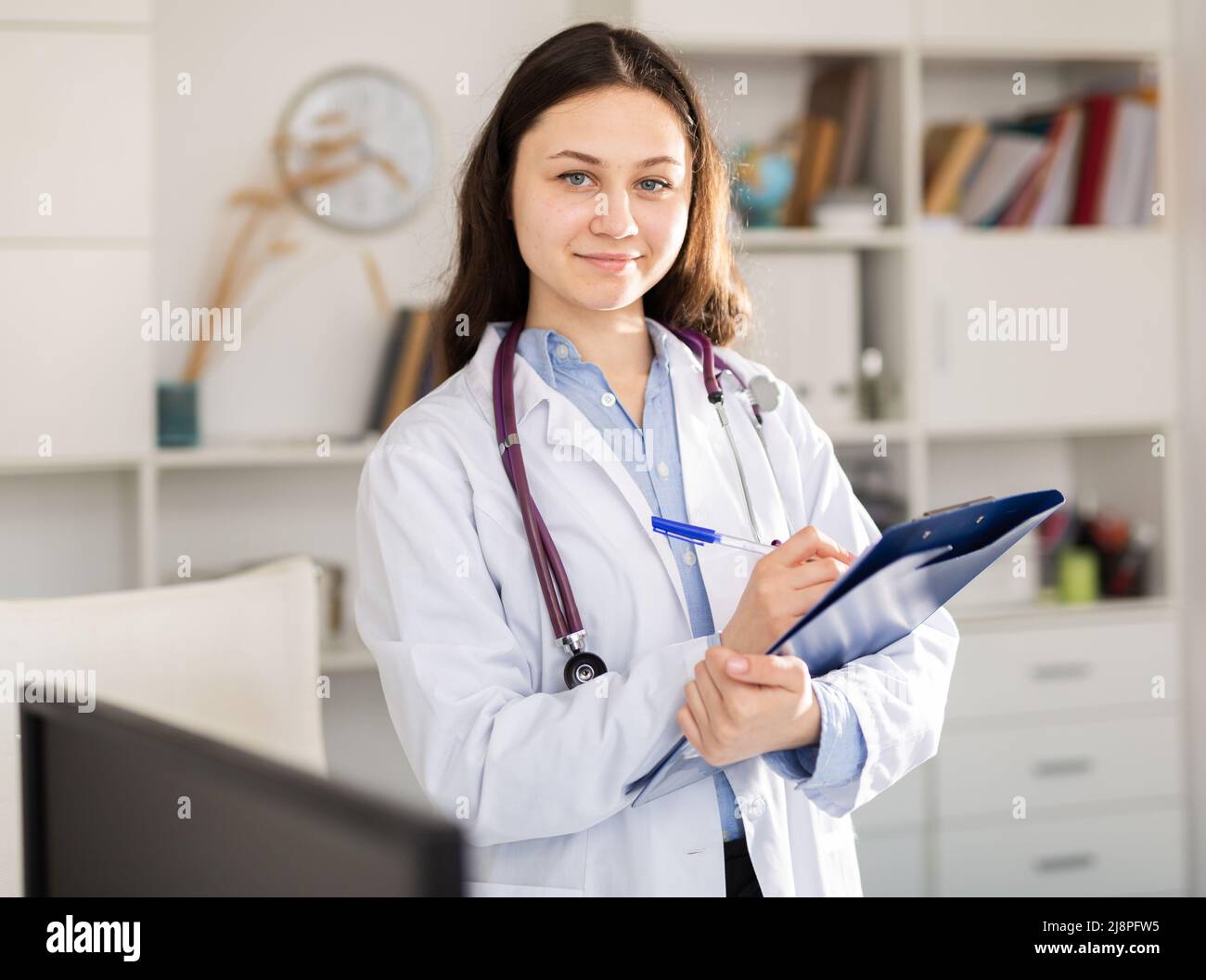 Doctor trainee who is undergoing an internship at the clinic makes ...