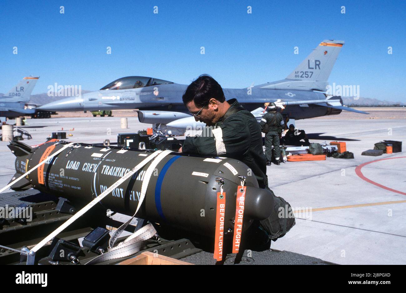 Staff sergeant securing cluster bomb on a munitions trailer Stock Photo ...