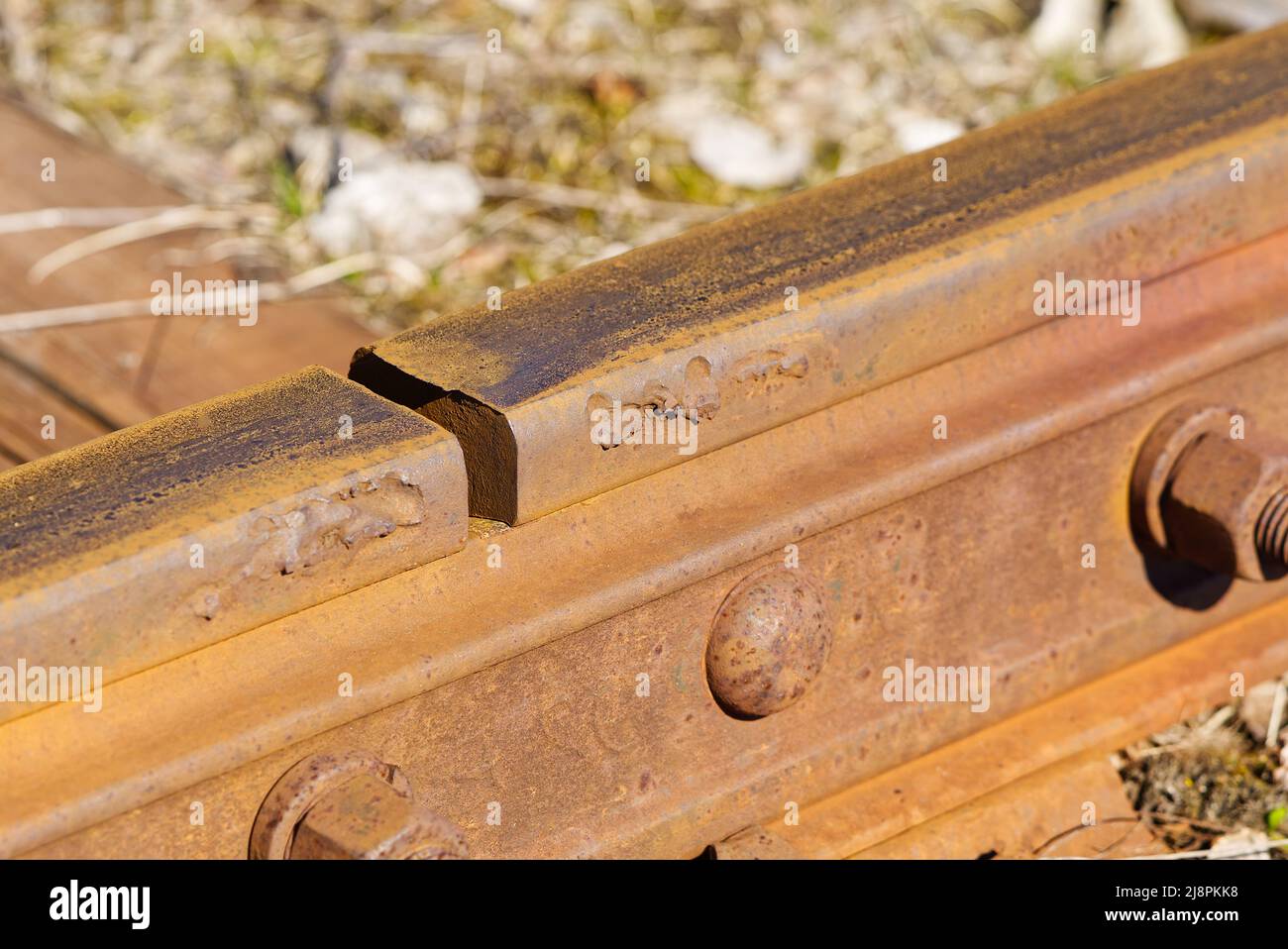 Connecting two rails. Train tracks underlay, rails and crushed stones ...