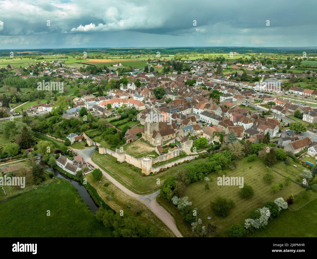Aerial view of Ainay le Chateau from the east, small medieval town in ...