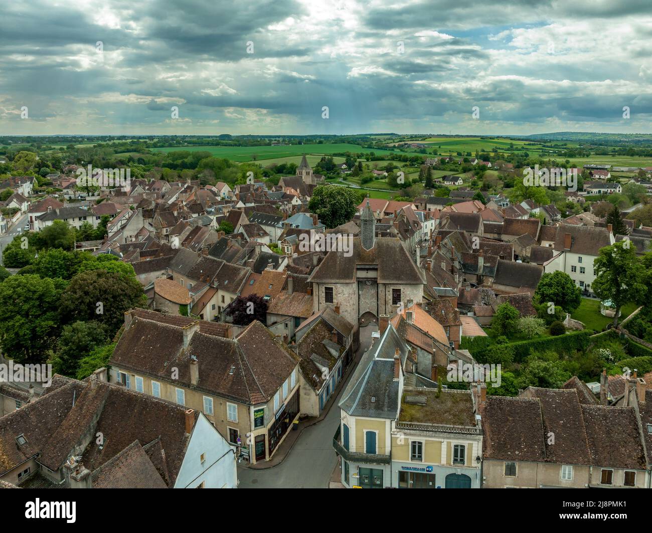 Aerial view of Ainay le Chateau from the east, small medieval town in ...