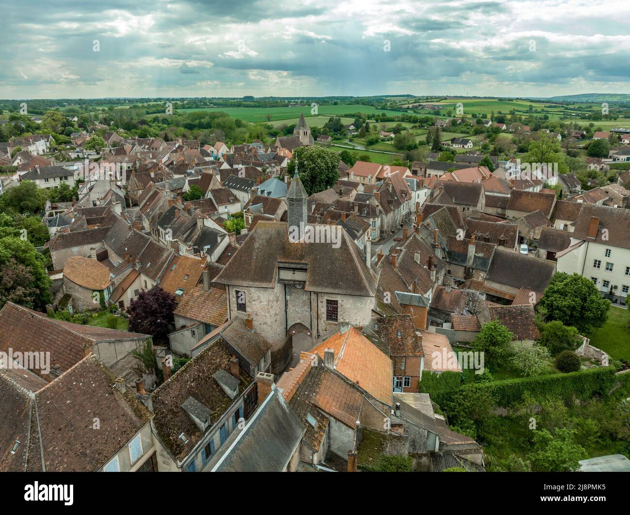 Aerial view of Ainay le Chateau from the east, small medieval town in ...