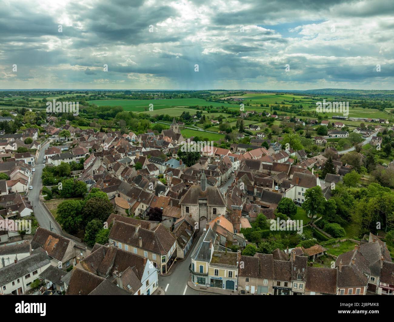 Aerial view of Ainay le Chateau from the east, small medieval town in ...