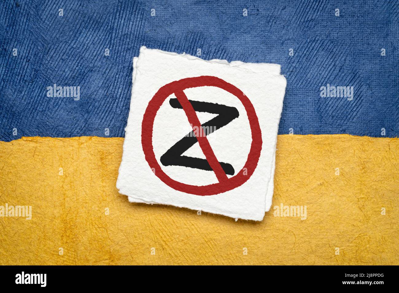 Z letter marked out against blue and yellow paper abstract in colors of ...