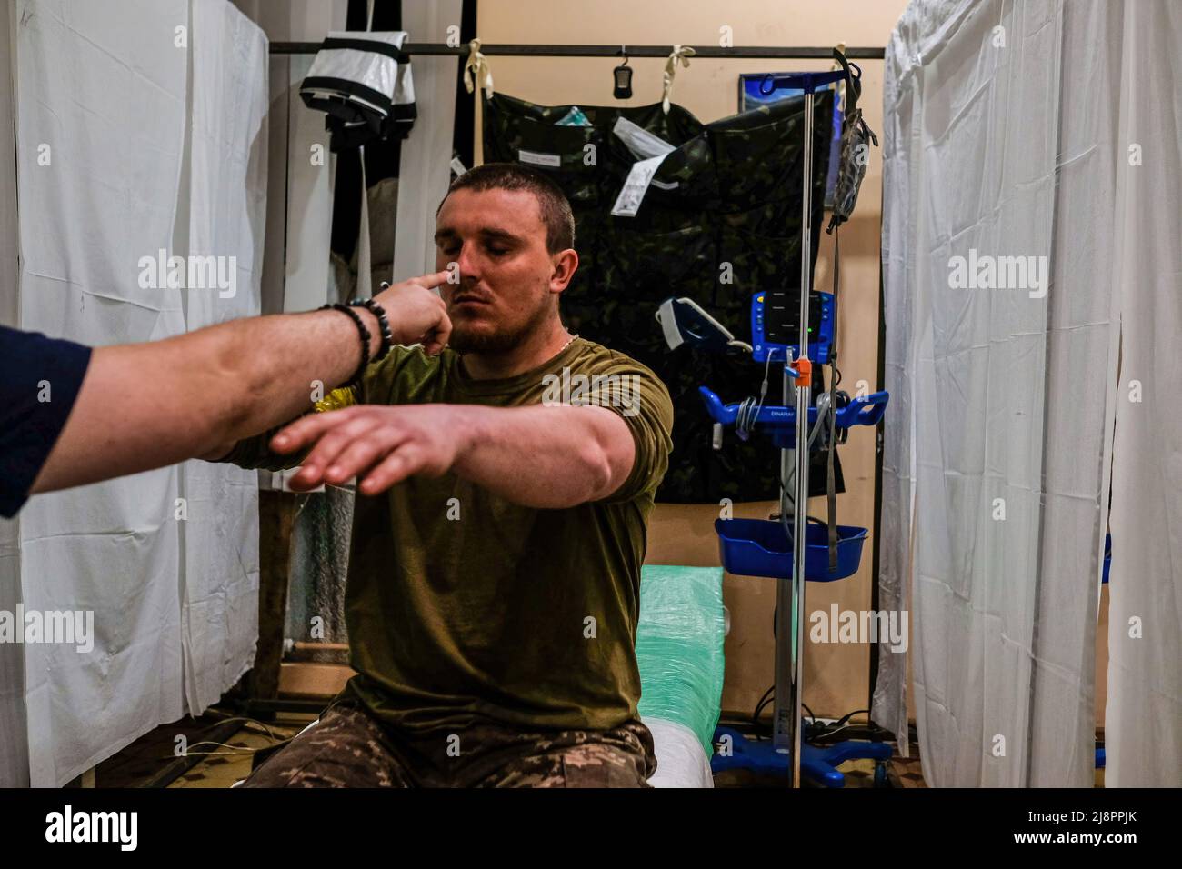 A soldier with concussion seen doing a neurological test in the ...