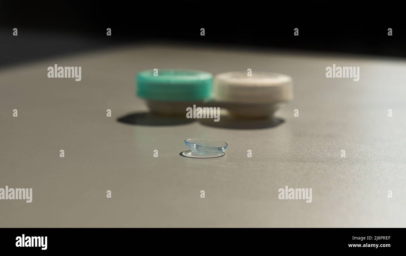 Contact lenses and a storage container on a white table Stock Photo - Alamy