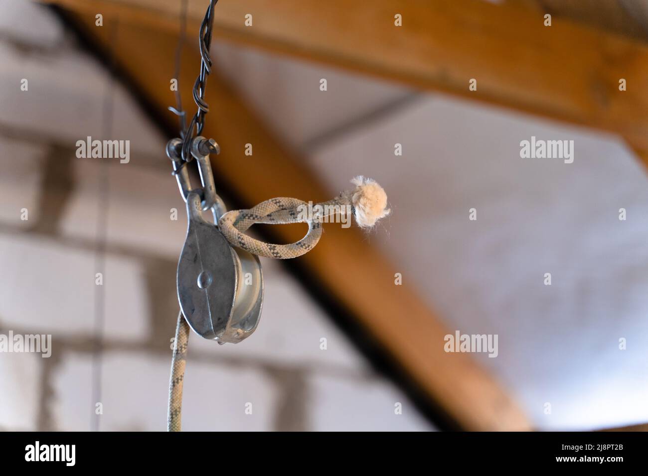 Block roller rigging steel for a rope close-up at a construction site ...