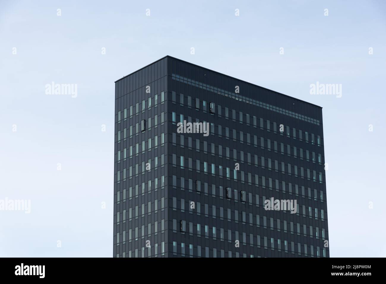 Minimalist modern high-rise building with clear blue sky Stock Photo ...