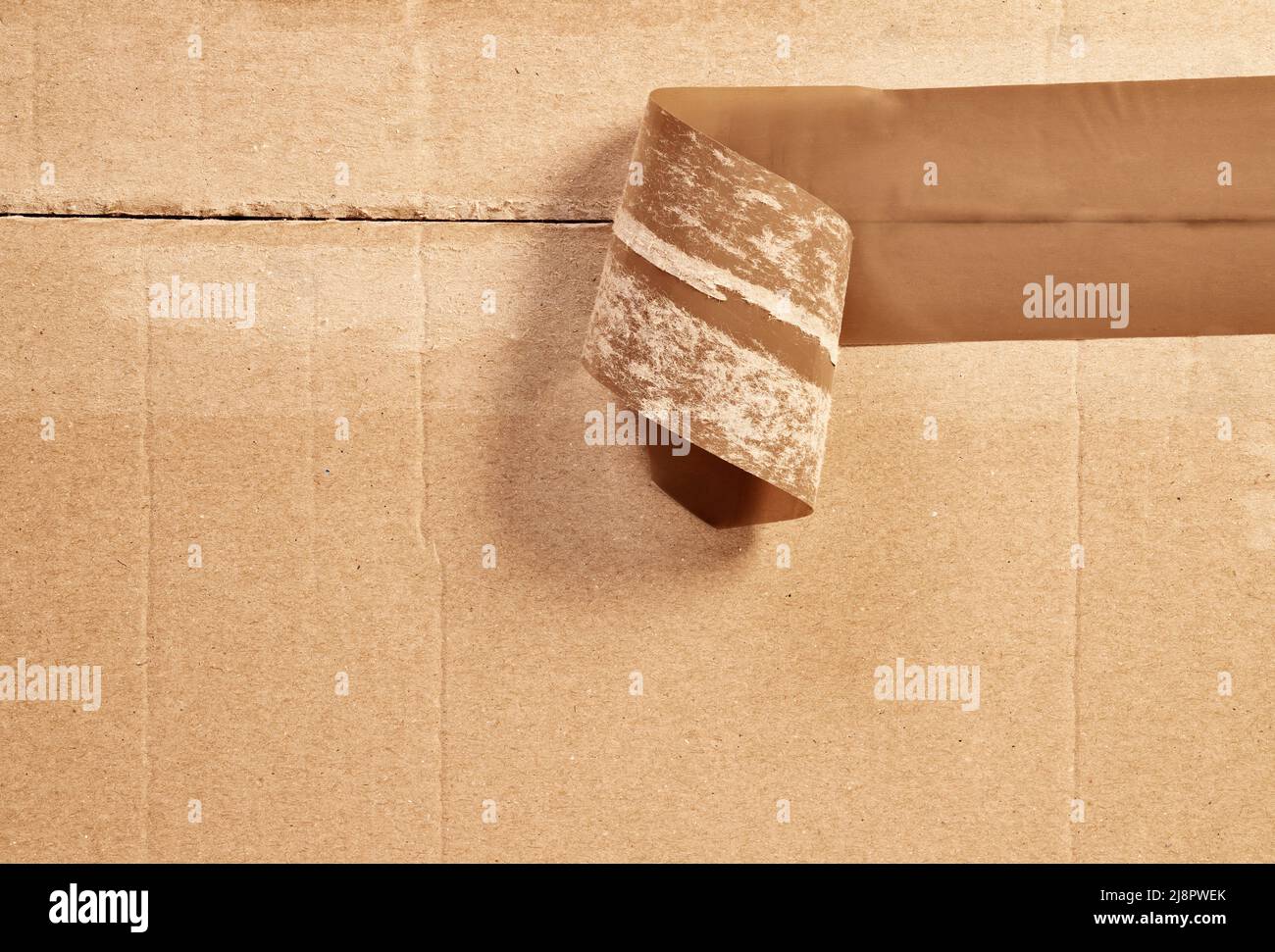 Detail of brown adhesive tape on cardboard box Stock Photo - Alamy