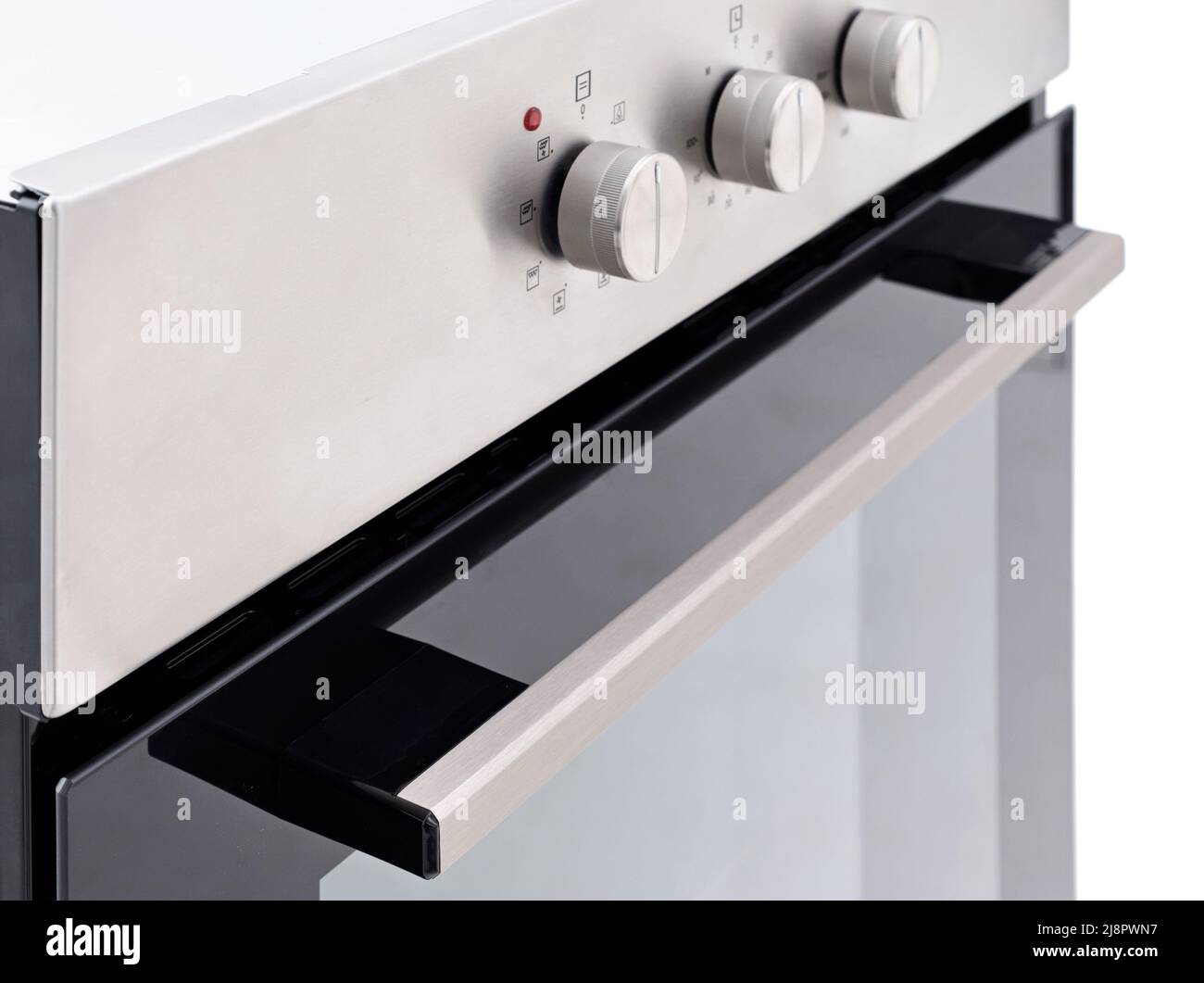 Three round electric oven control knobs, on a silver panel Stock Photo ...