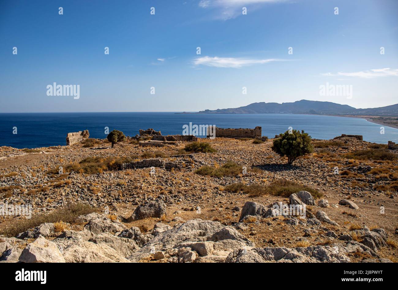 Ruined Feraklos castle overlooking Charaki, Rhodes, Greece Stock Photo ...