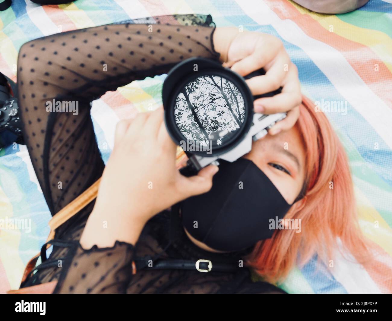 Pretty Girl Holding a DSLR Camera Stock Photo - Alamy