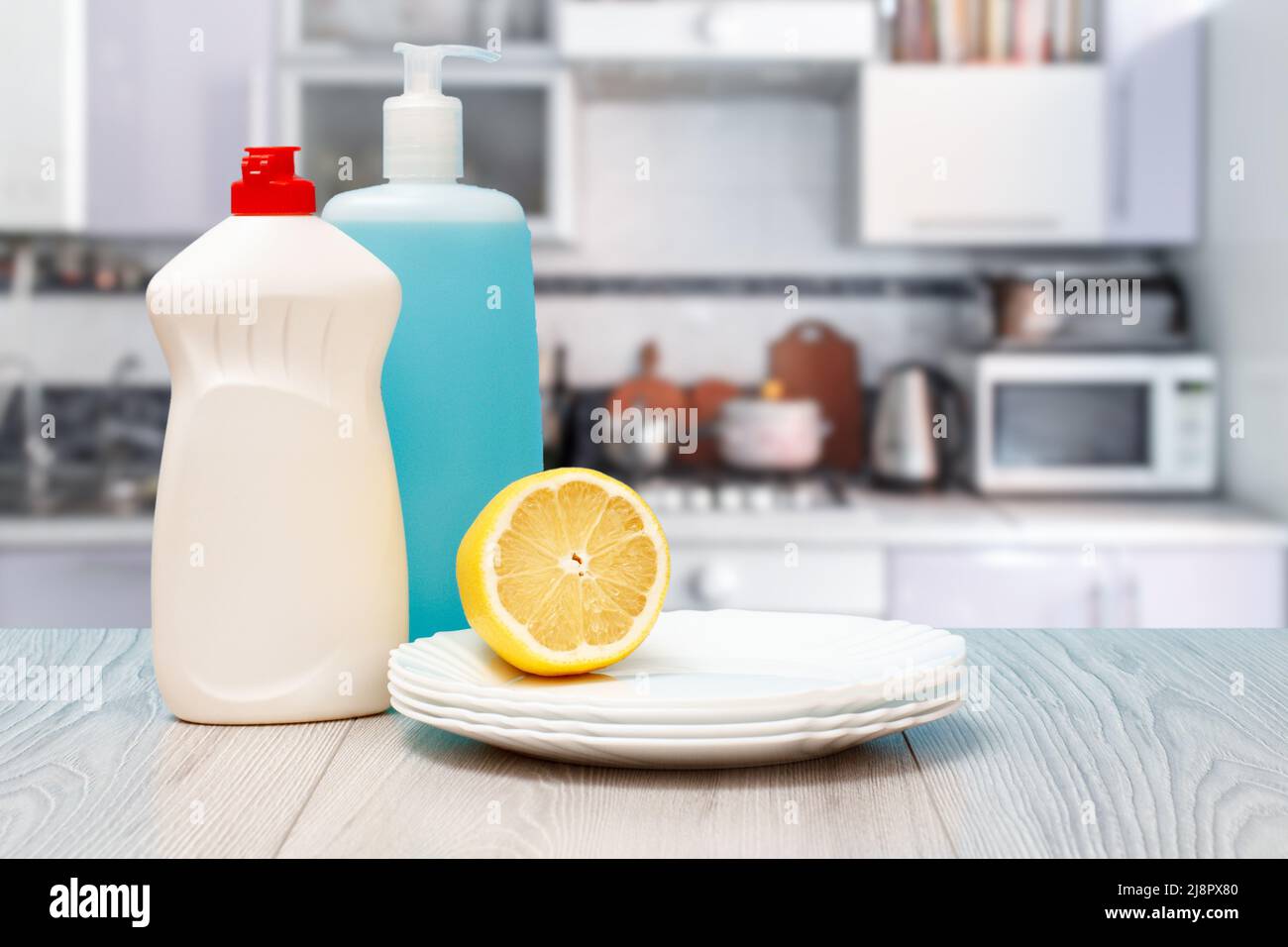 Plastic bottles of dishwashing liquid, glass and tile cleaner, clean ...