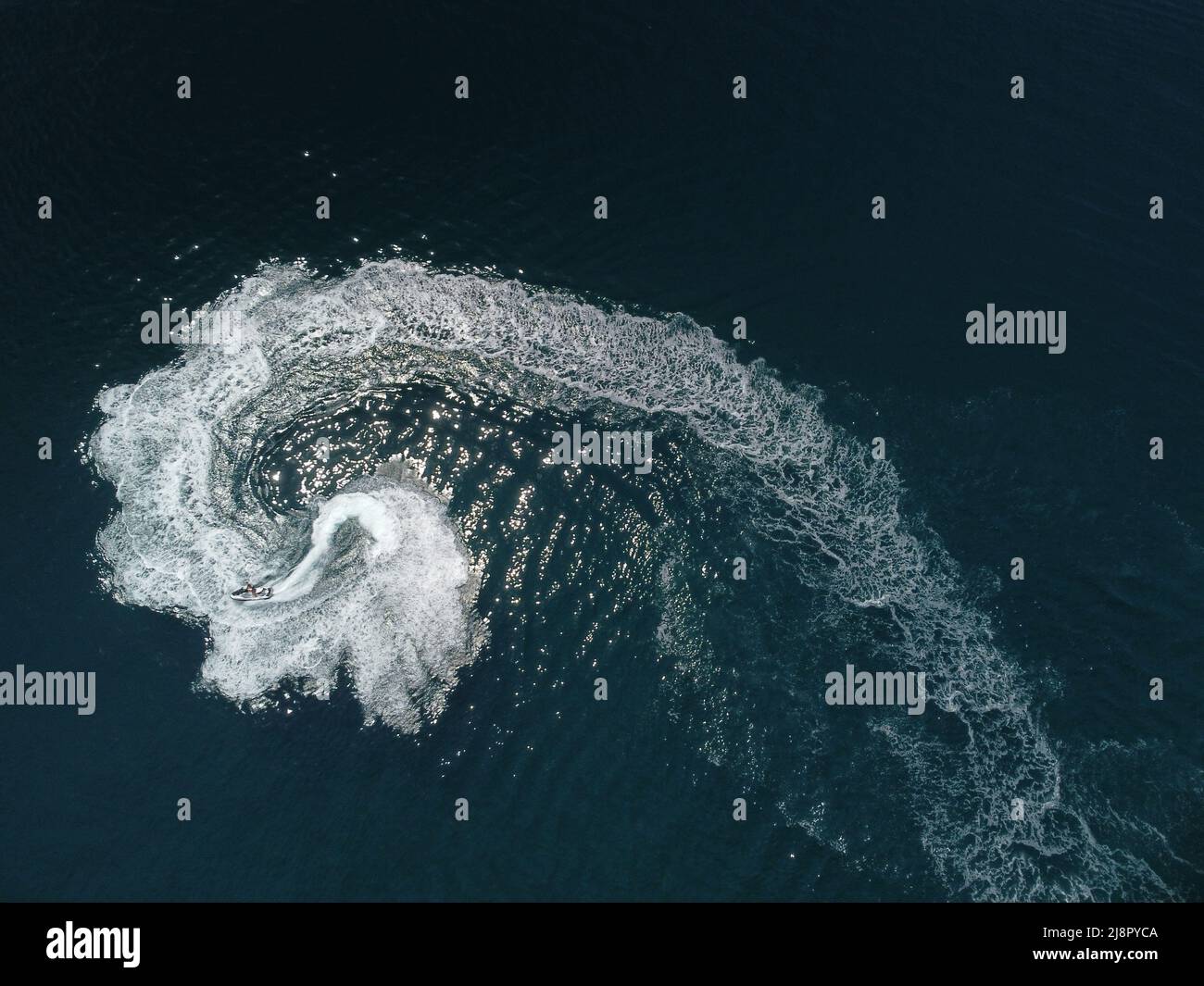 Aerial top down view of water foam trace with nice deep blue shade of ...