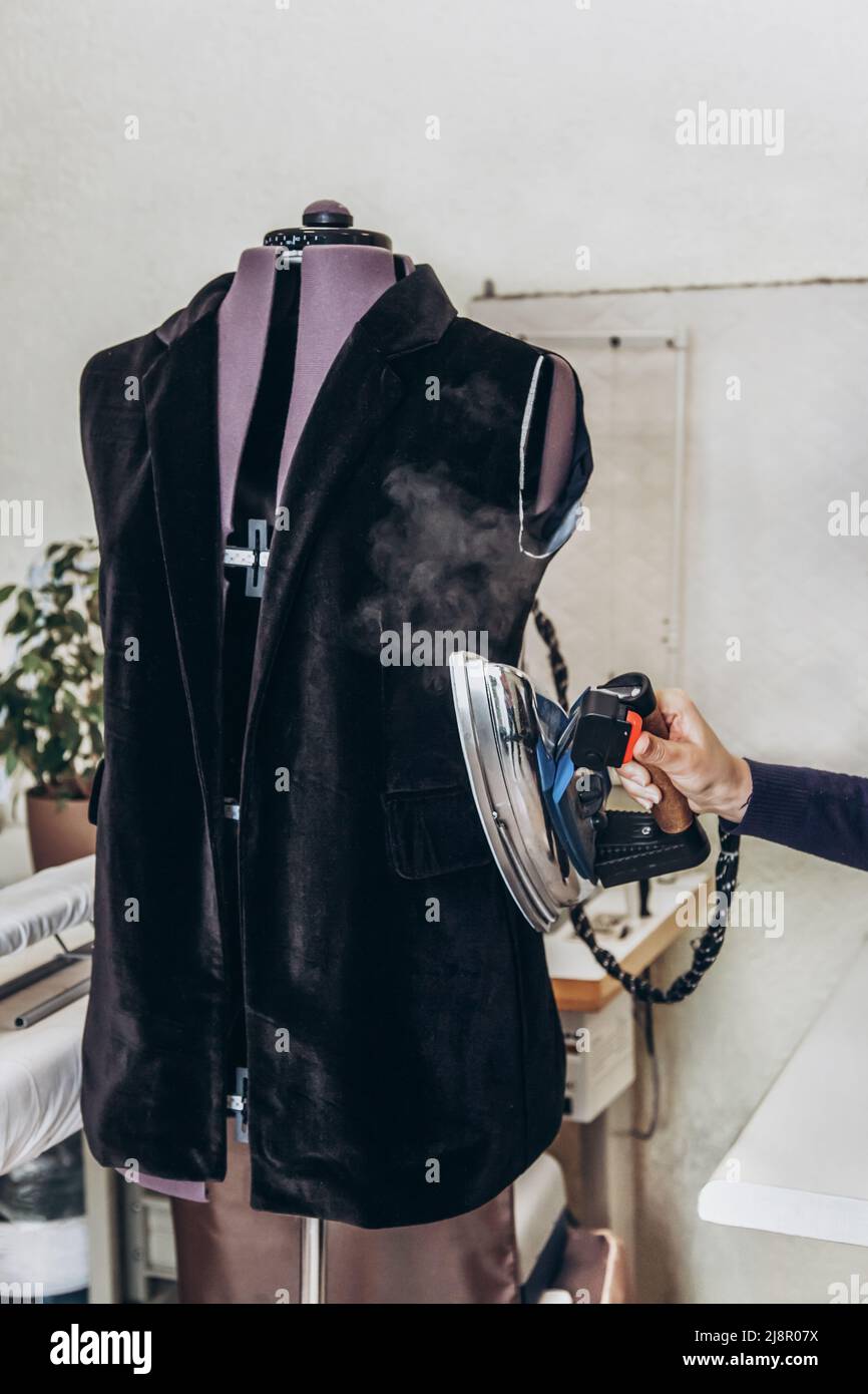 Woman irons clothes hi-res stock photography and images - Alamy