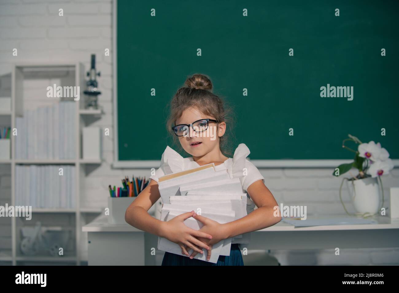 School girl studying math on lesson in classroom at elementary school ...